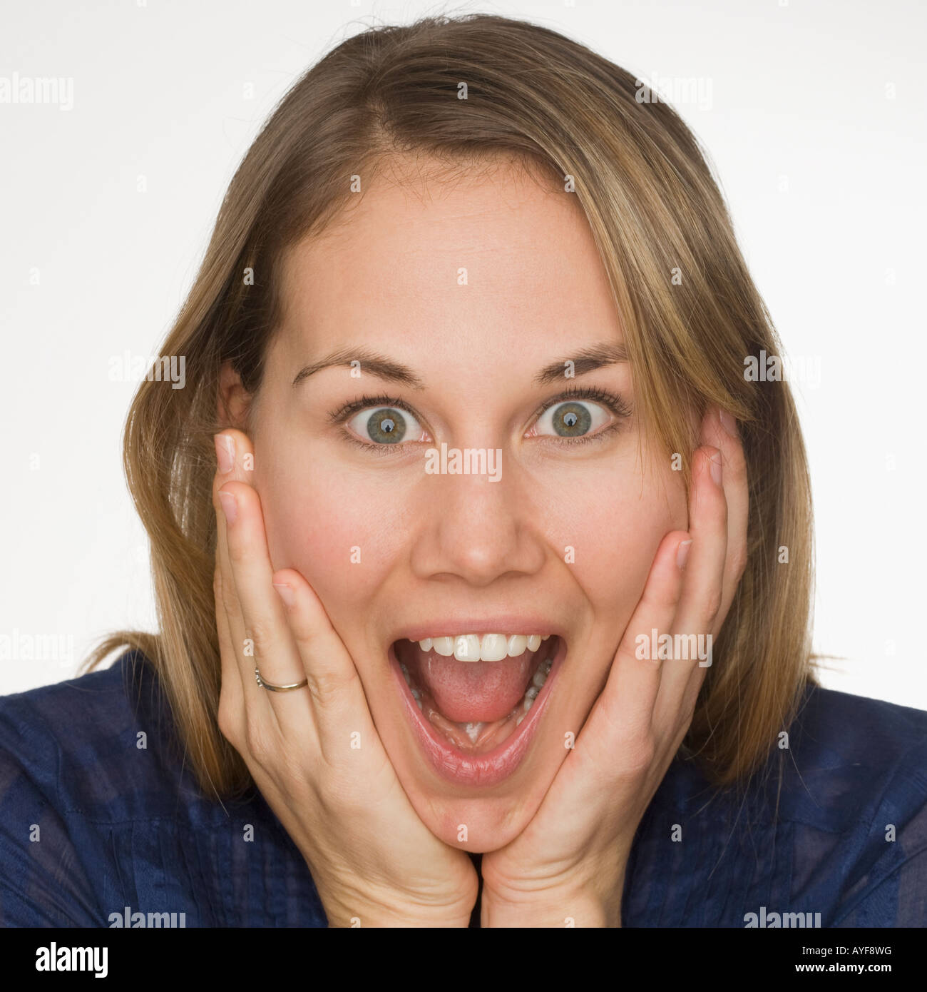 Close up of woman looking surprised Stock Photo - Alamy