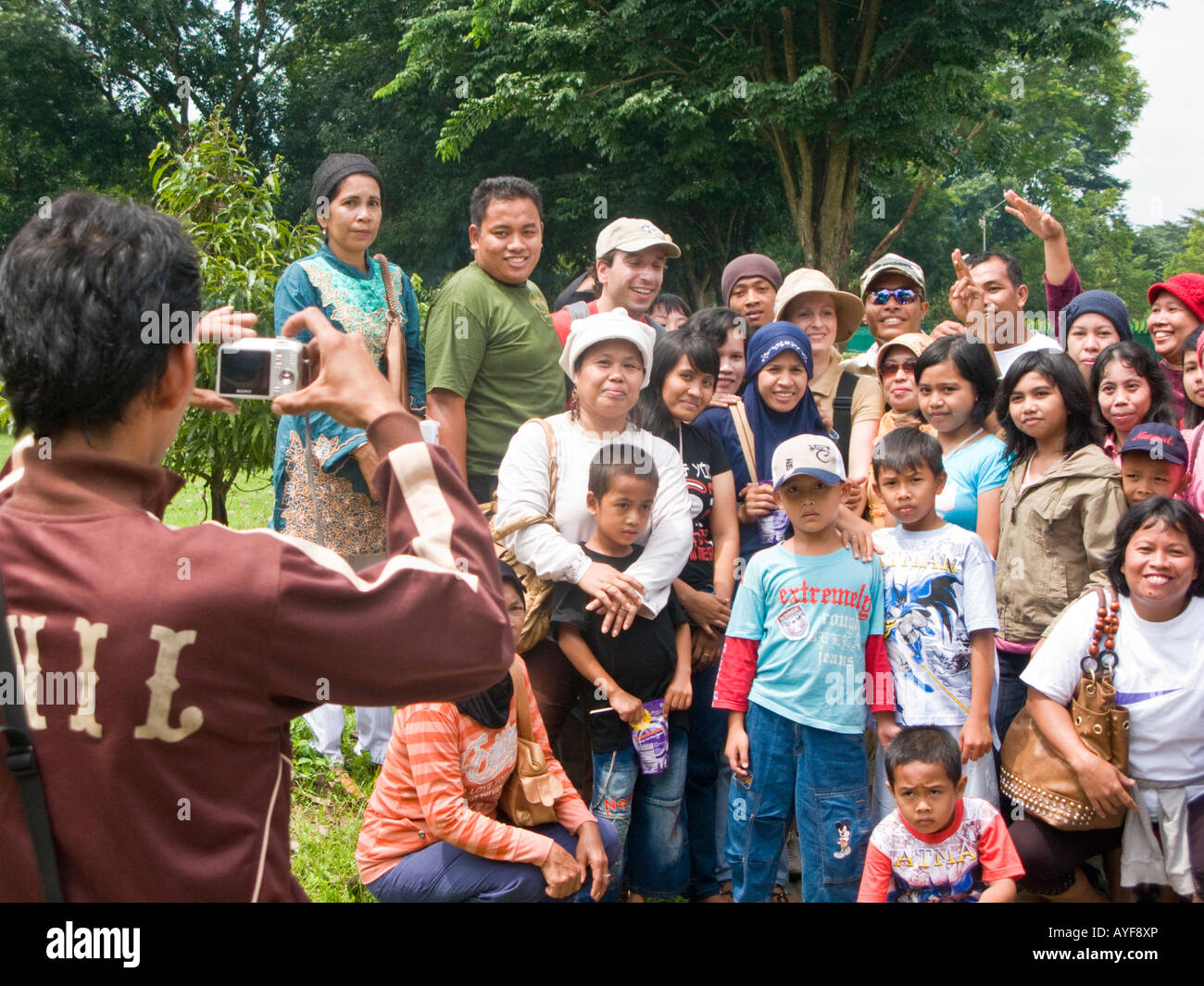 photographer photographing Indonesian student trip at Prambanam, Java ...