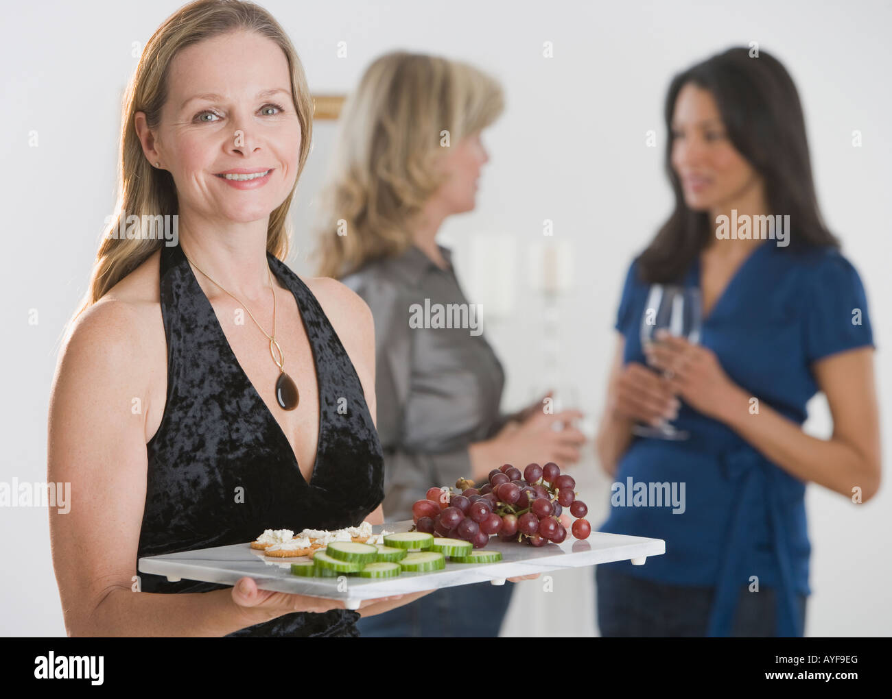 Woman holding tray profile hi-res stock photography and images - Alamy