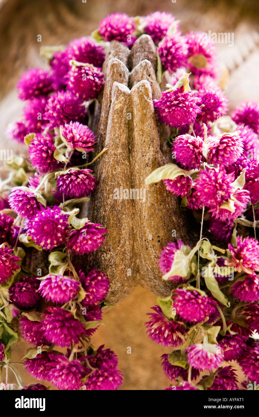 Indian stone deity statue prayer hands covered in devotional flowers ...