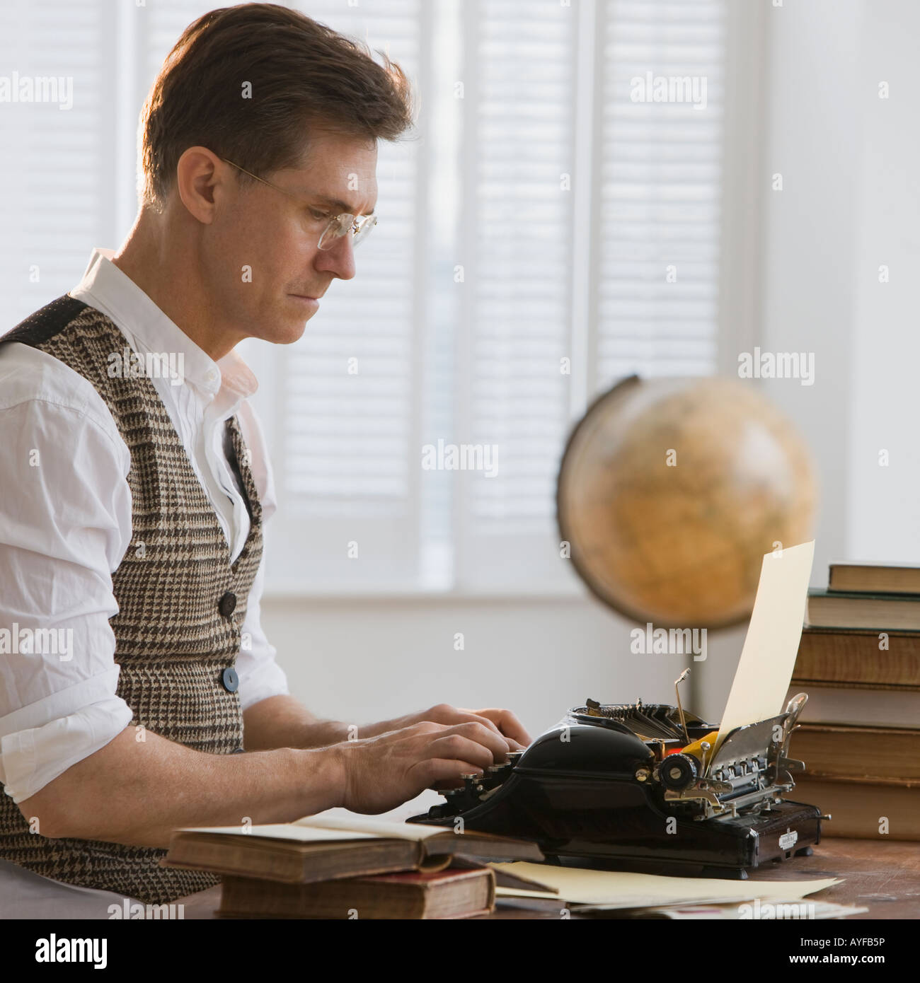 Man typing on antique typewriter Stock Photo - Alamy