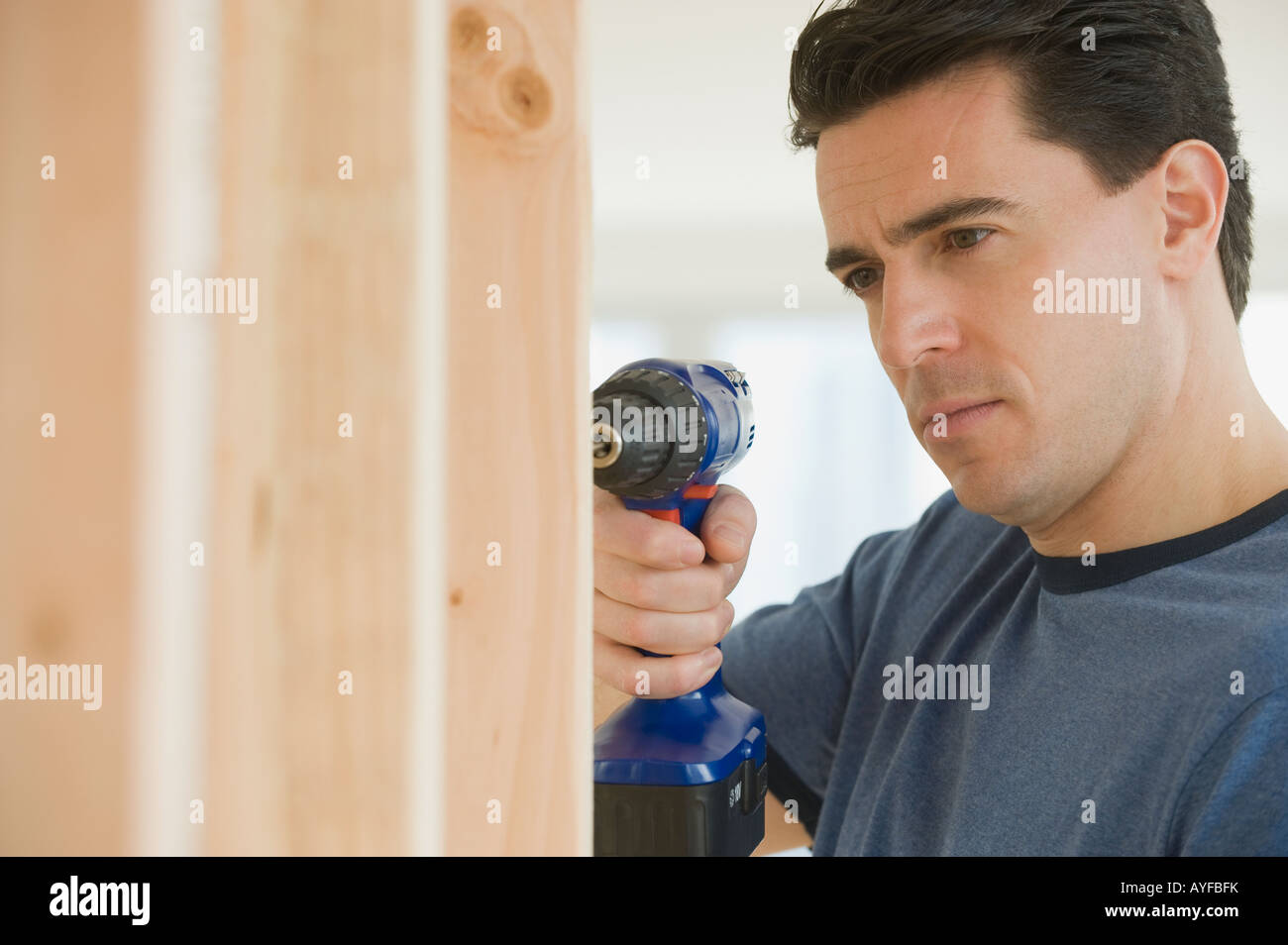 Man using cordless drill Stock Photo - Alamy