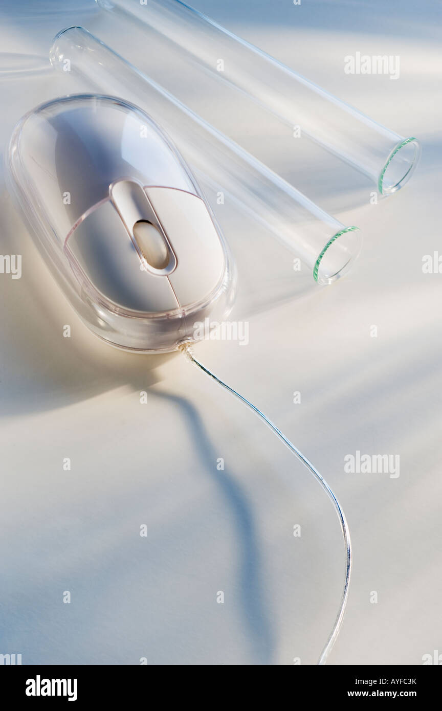 Empty vials next to computer mouse Stock Photo - Alamy