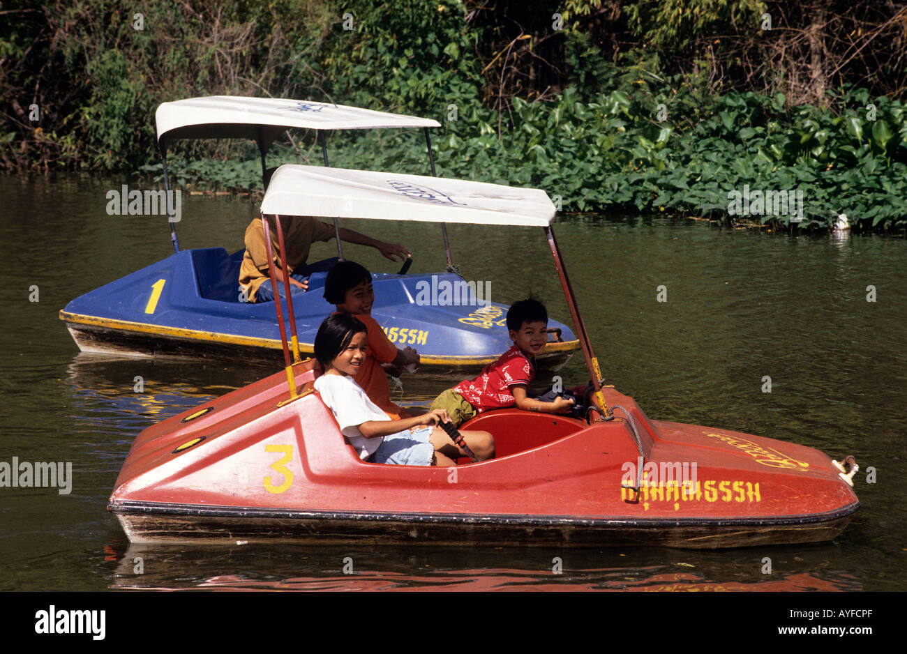 Children playing with boats hi-res stock photography and images - Alamy