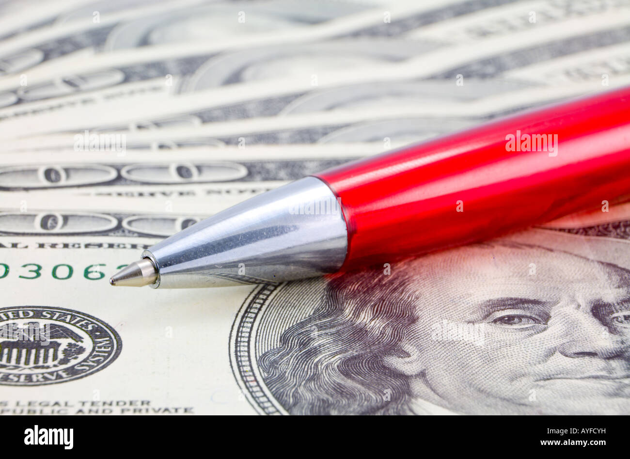 the red pen macro on dollar background Stock Photo - Alamy
