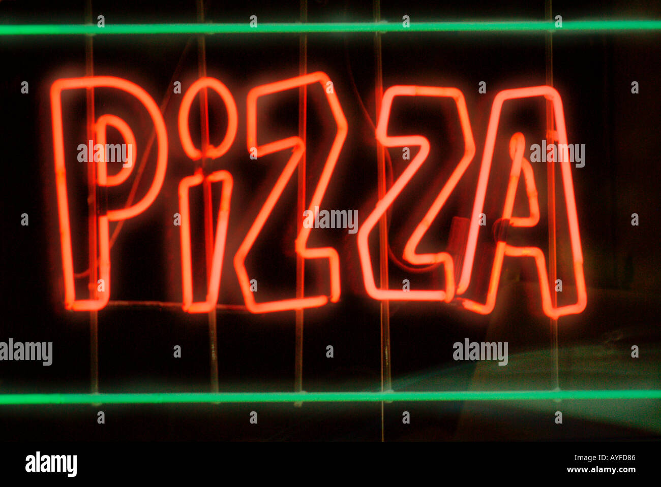 A neon sign saying PIZZA in a restaurant window Stock Photo - Alamy