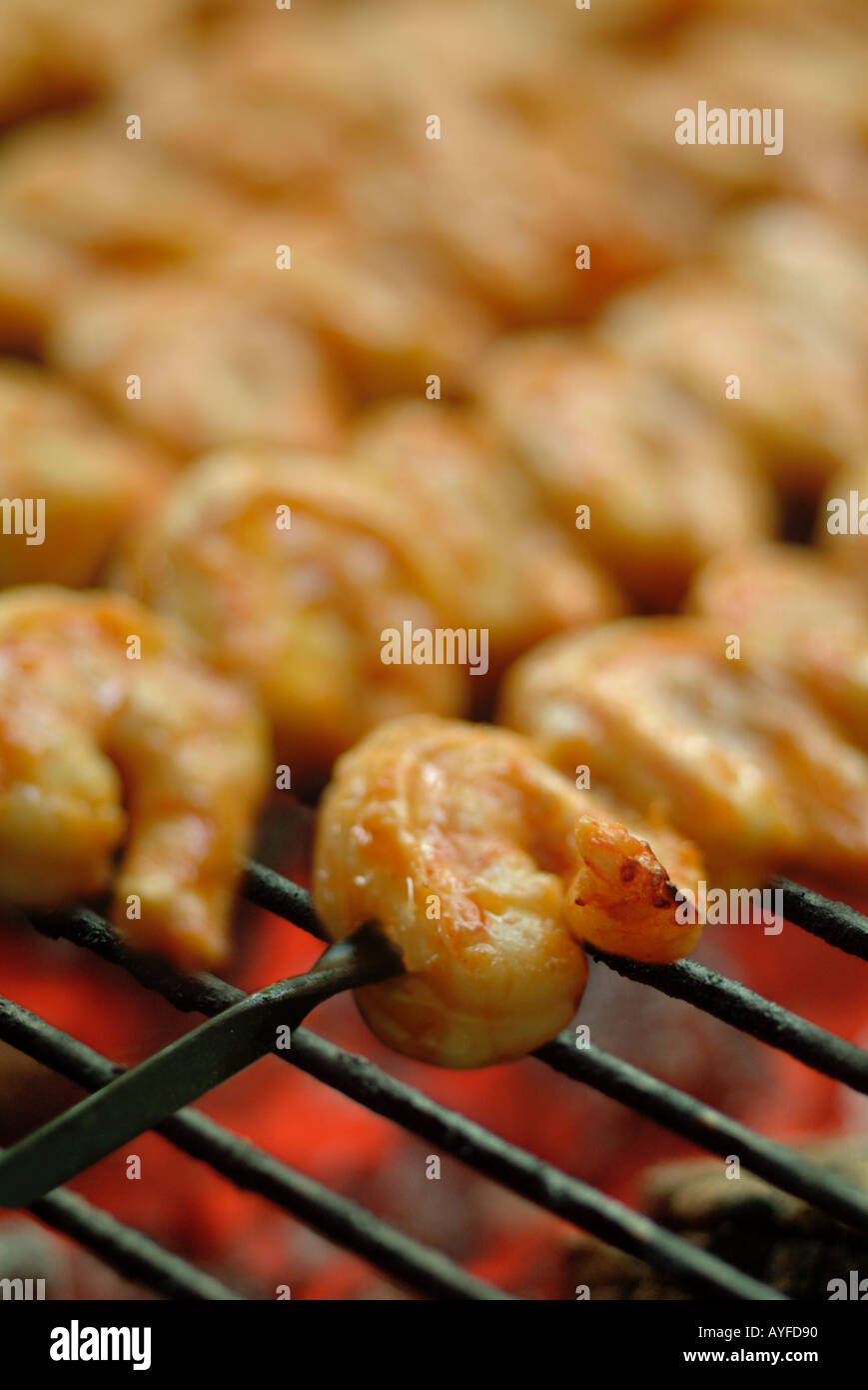 Skewered and marinated shrimp on the grill or bar-b-que Stock Photo - Alamy