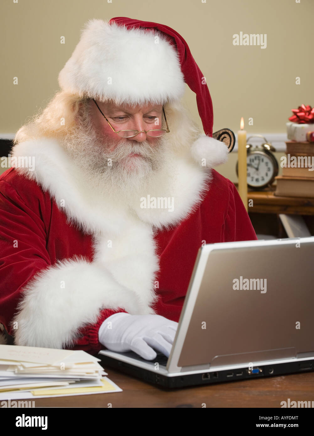 Santa Claus looking at laptop Stock Photo - Alamy