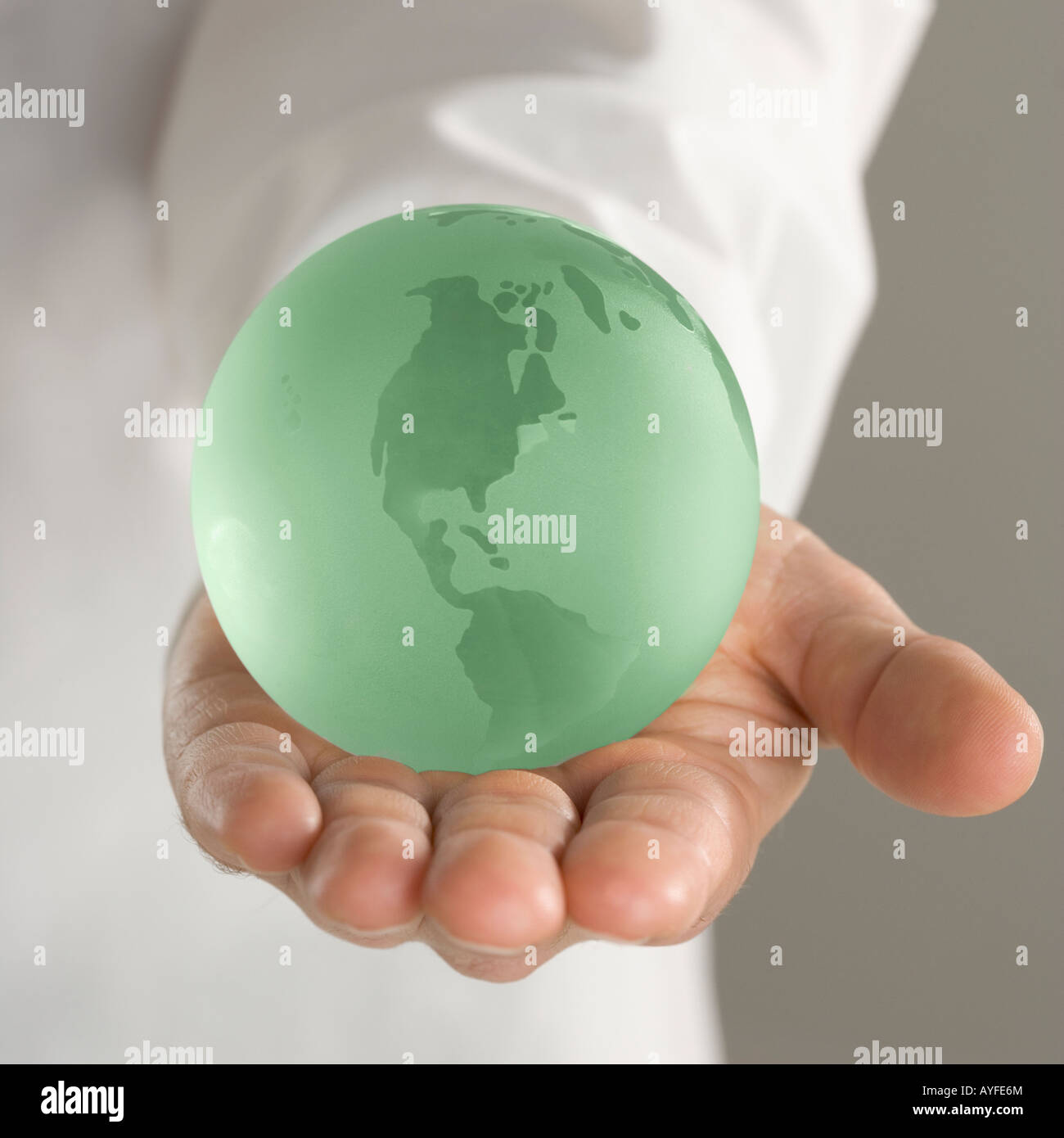 Hand holding globe Stock Photo - Alamy