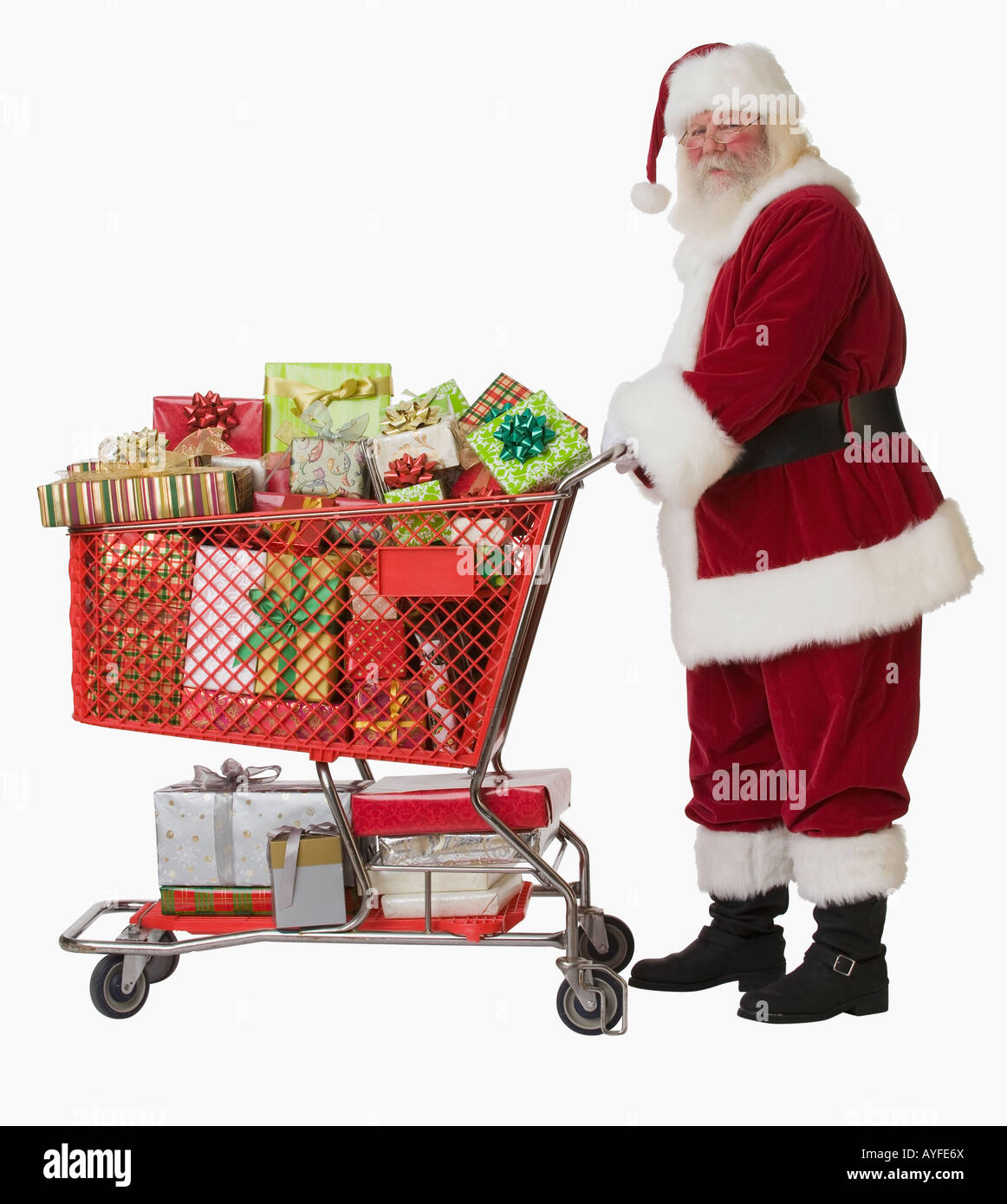 Santa Claus pushing shopping cart full of gifts Stock Photo - Alamy