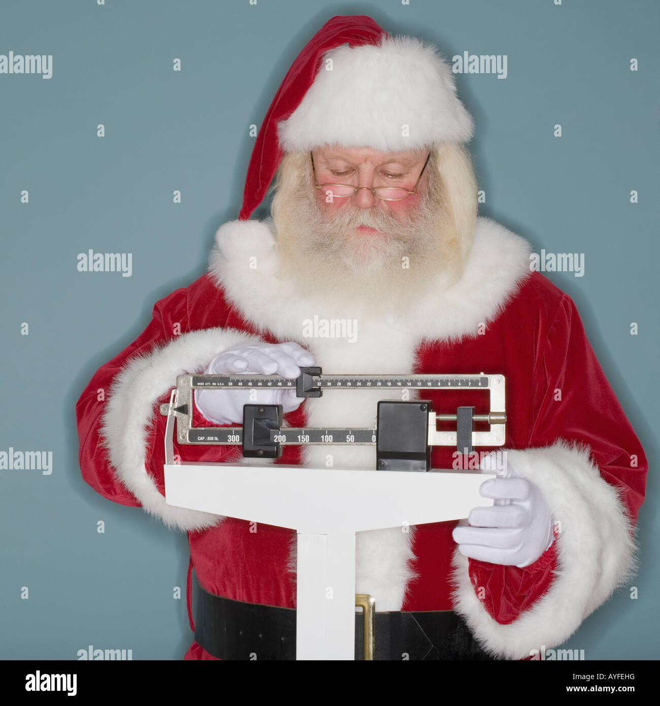 Santa Claus standing on scale Stock Photo - Alamy