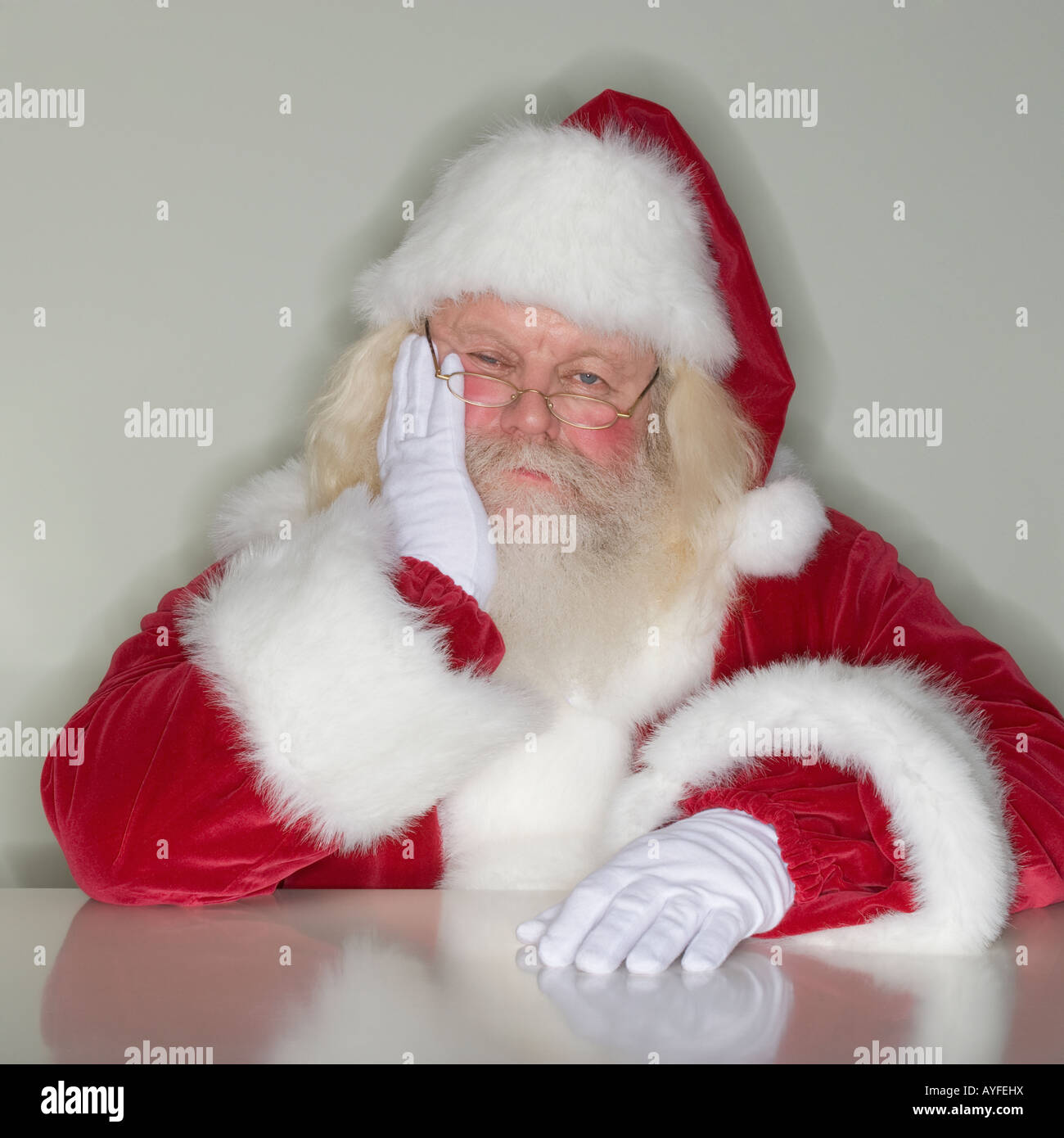 Santa Claus leaning on table Stock Photo - Alamy