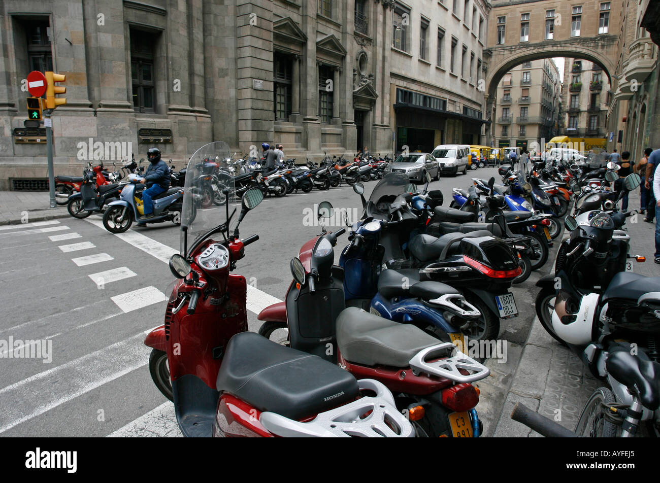 Mopeds parked in a street in Barcelona Spain Europe Stock Photo - Alamy