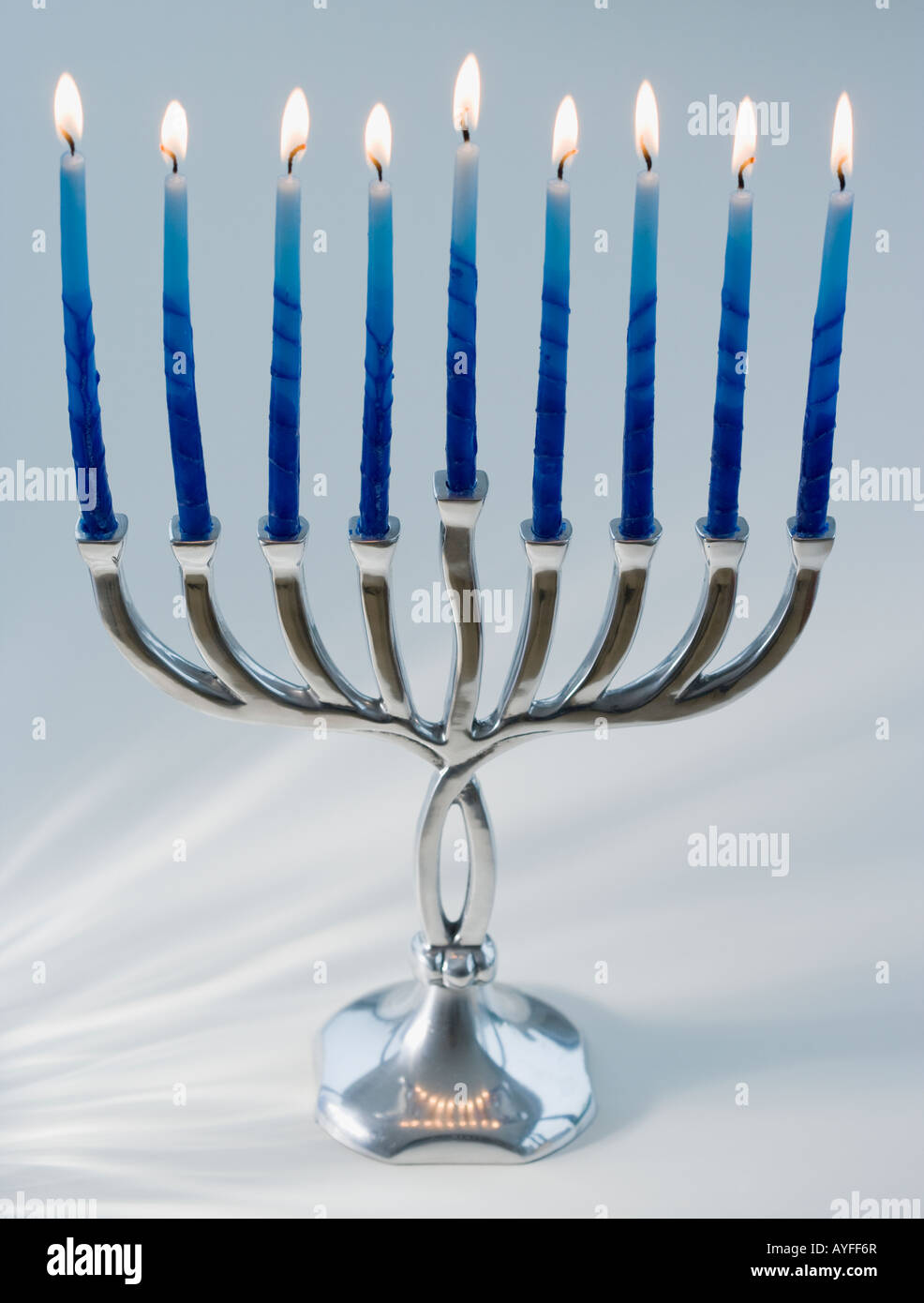 Close up of menorah with lit candles Stock Photo - Alamy