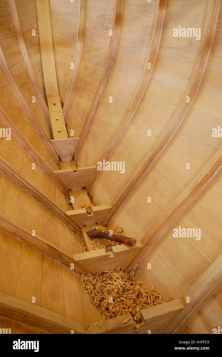 Inside the hull of a classic wooden sailing yacht under construction ...