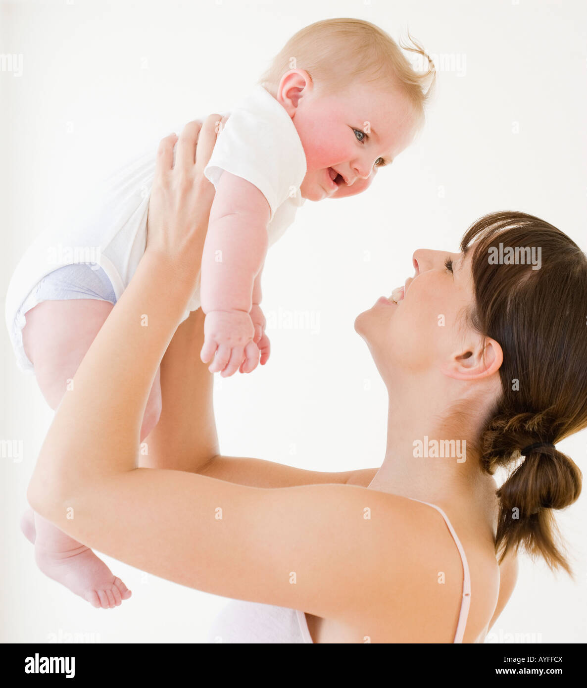 Mother smiling at baby Stock Photo - Alamy