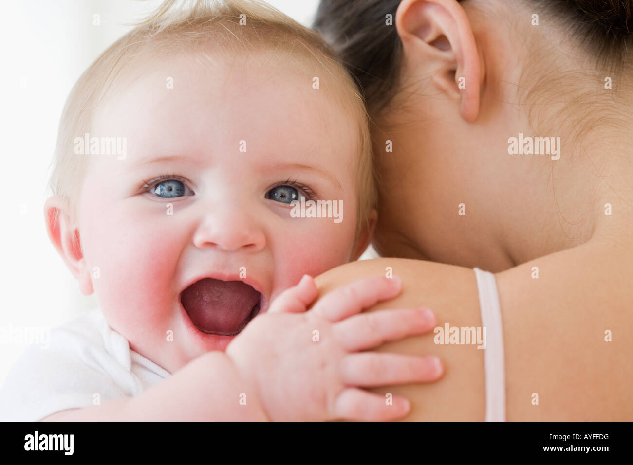 Baby over shoulder hi-res stock photography and images - Alamy