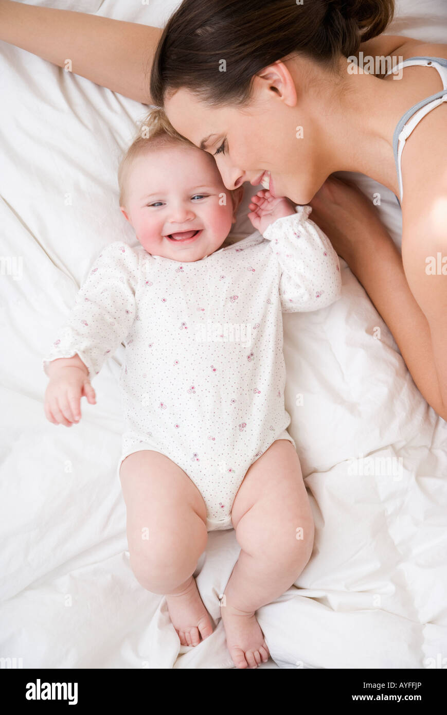 Mother smiling at baby Stock Photo - Alamy