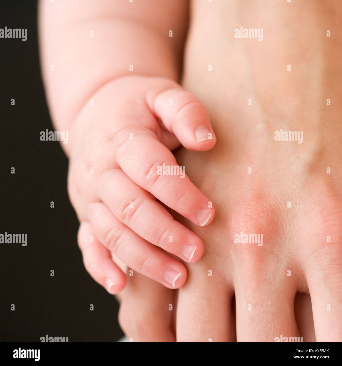 Baby Touching Mothers Hand Stock Photos & Baby Touching Mothers Hand ...