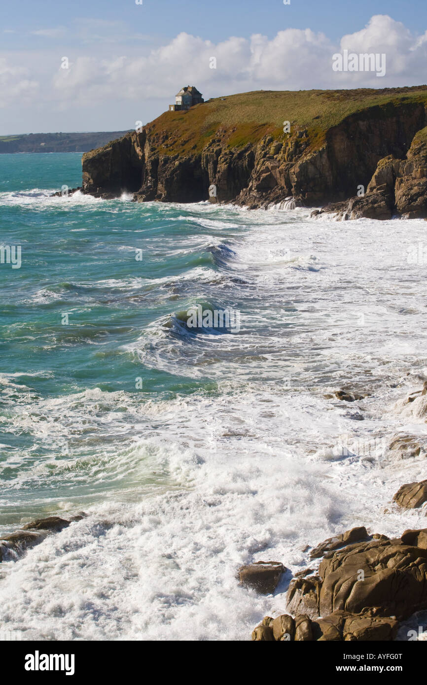 Waves crashing into Rinsey Cove and Cliffs with Rinsey Head in the ...
