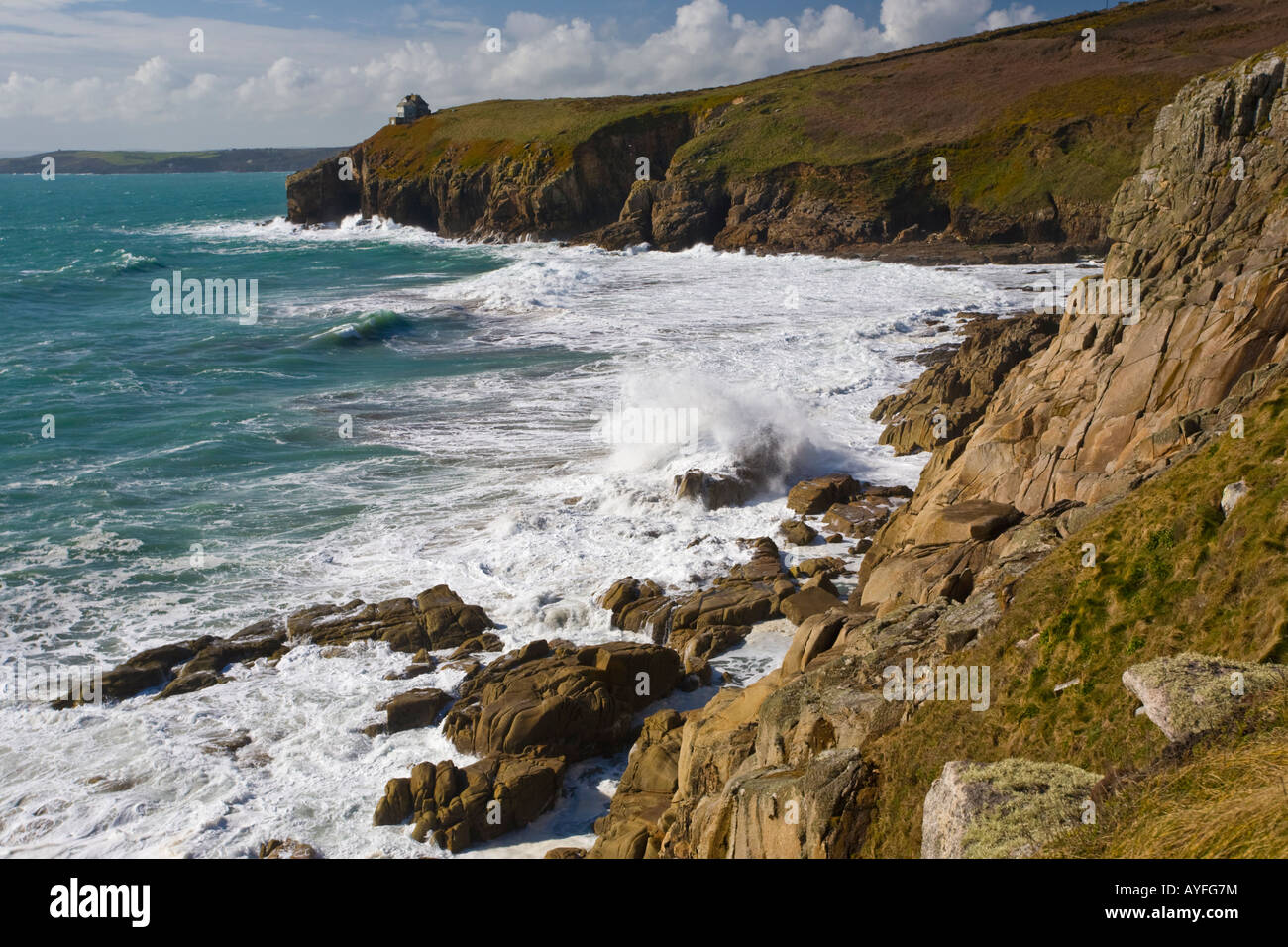 Waves crashing into Rinsey Cove and Cliffs with Rinsey Head in the ...