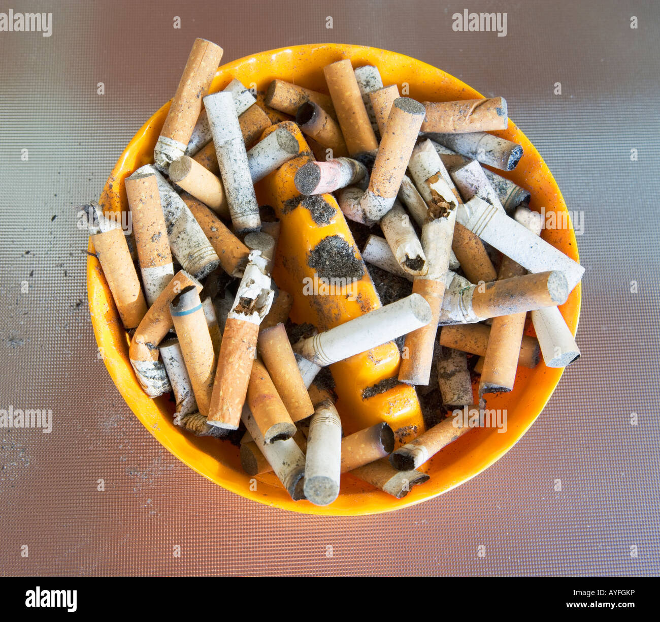 ashtray filled with many cigarette butts Stock Photo - Alamy