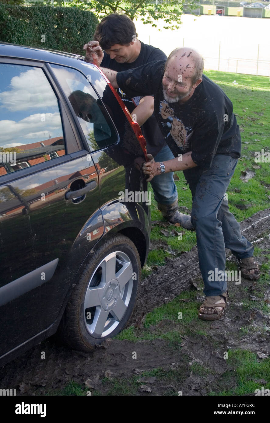Push car stuck mud hi-res stock photography and images - Alamy