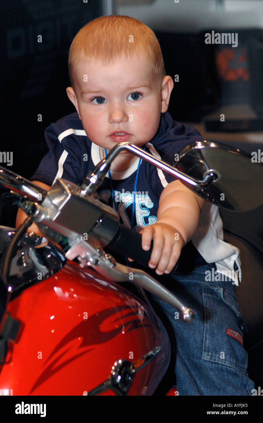 Little boy on a racing motorcycle Stock Photo - Alamy