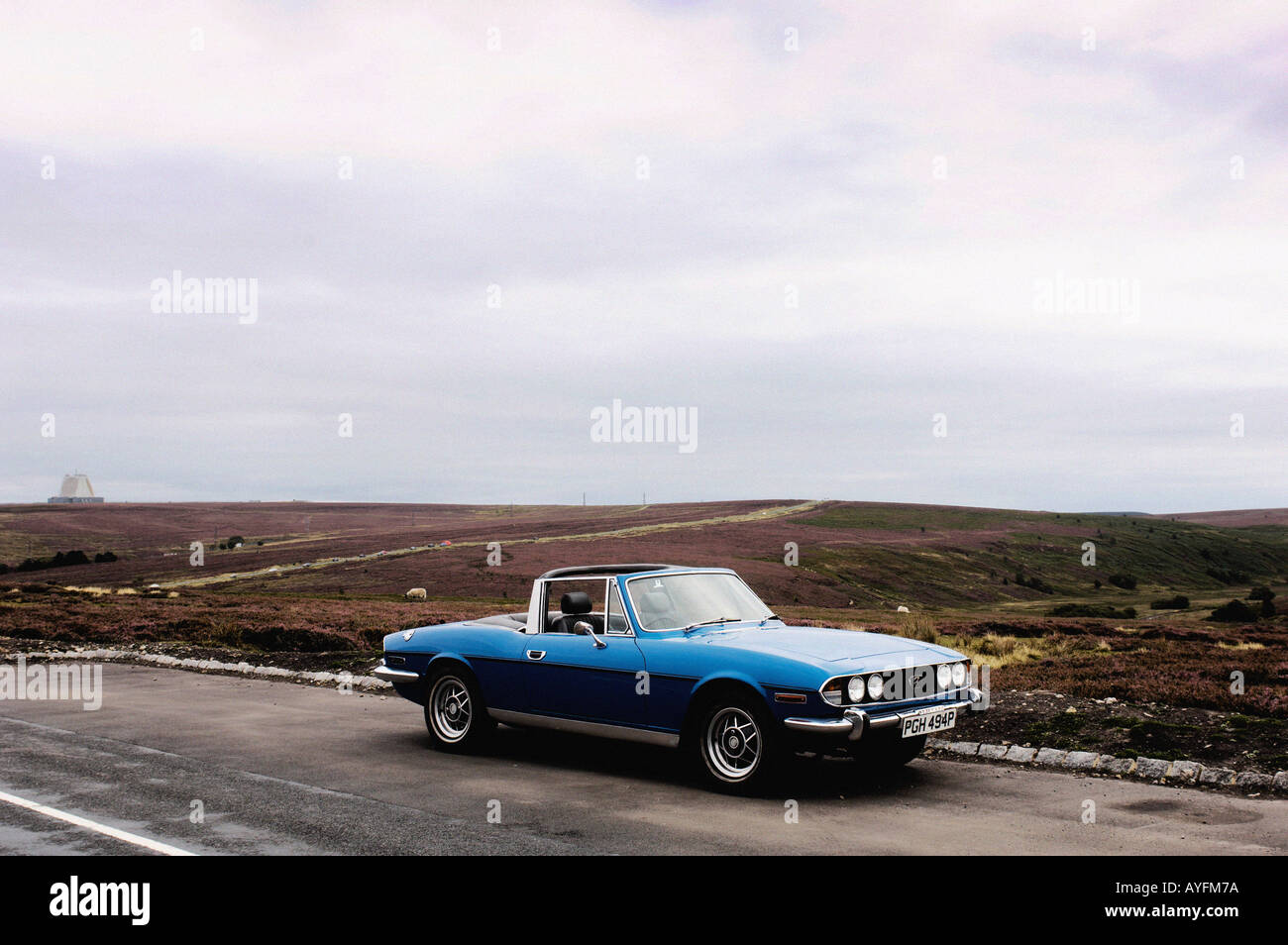 Blue Triumph Stag convertible car seen with North Yorkshire Moors in ...