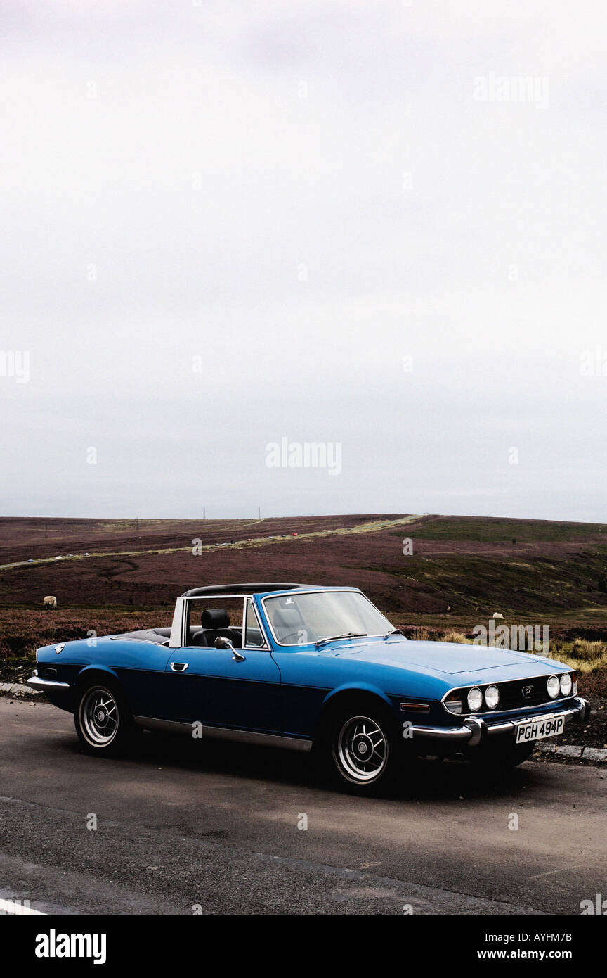 Blue Triumph Stag convertible car seen with North Yorkshire Moors in ...