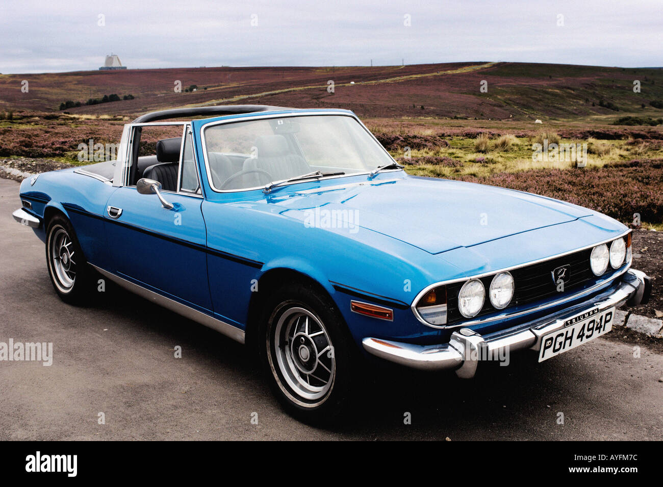 Blue Triumph Stag convertible car seen with North Yorkshire Moors in ...