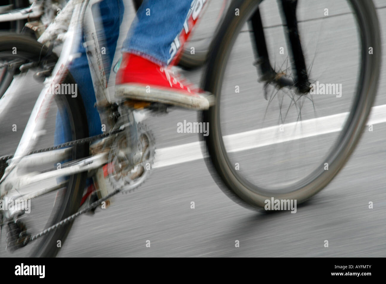 woman riding bike on street in town Stock Photo - Alamy