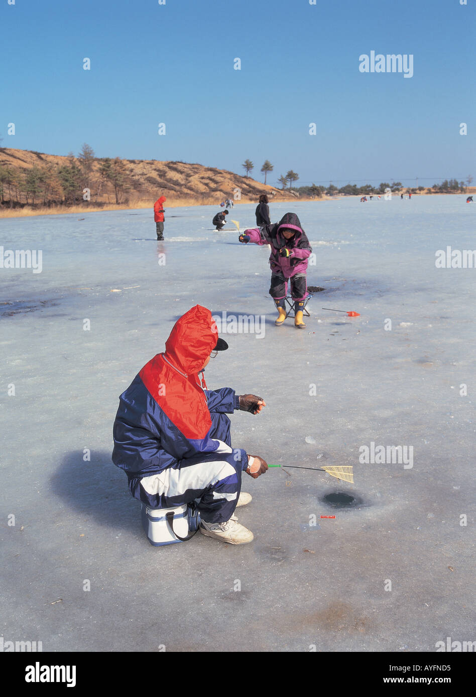 Fishing in Snow Stock Photo - Alamy