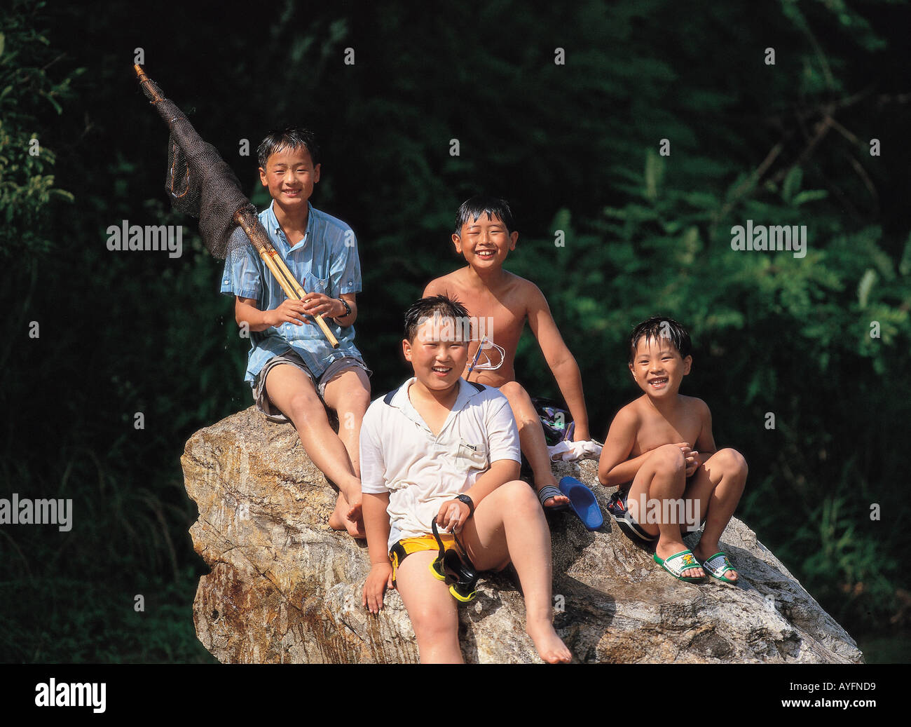 Kids on the Rock Stock Photo - Alamy
