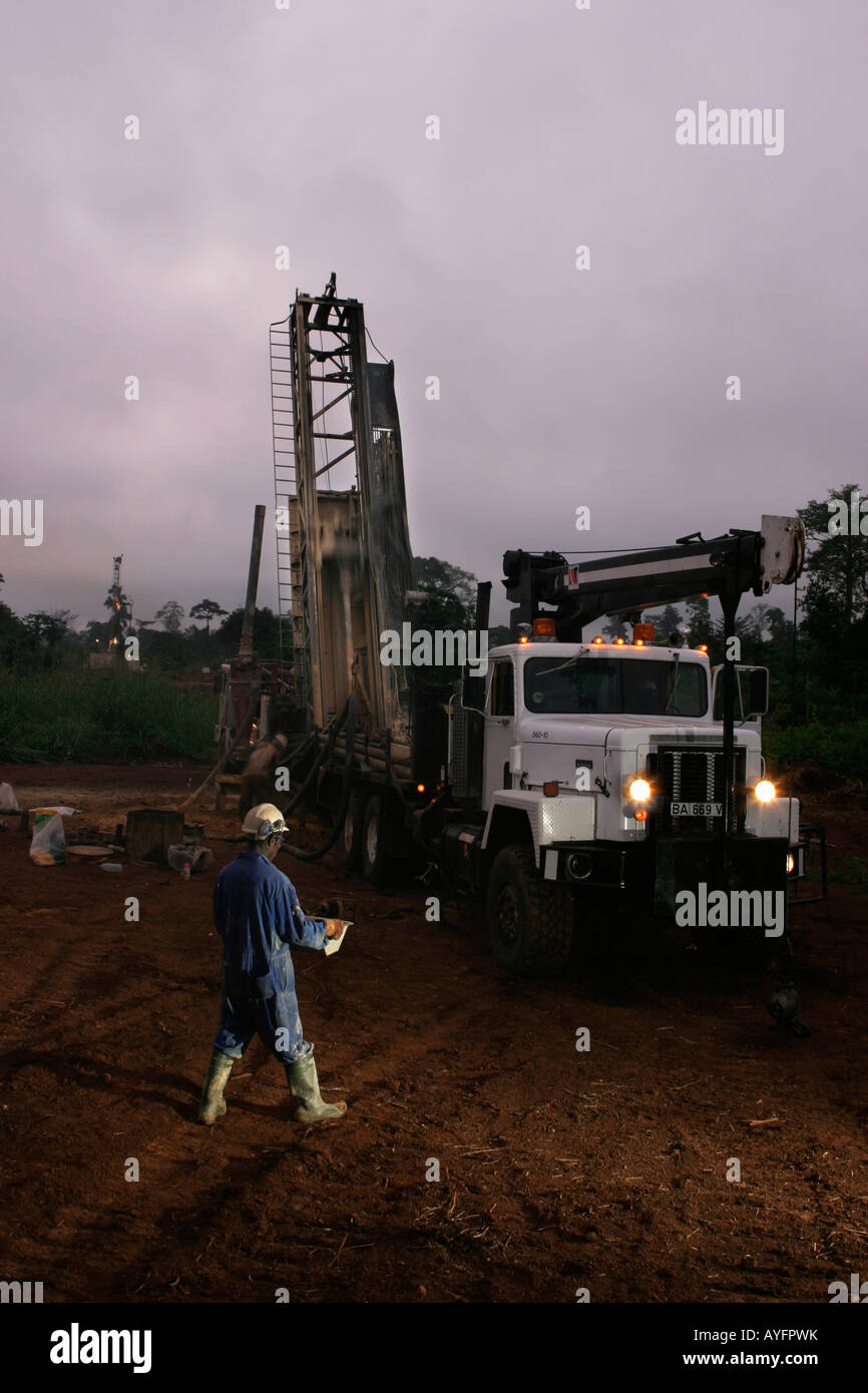 Dawn breaking over RC drill rig in bush while exploration core drilling ...
