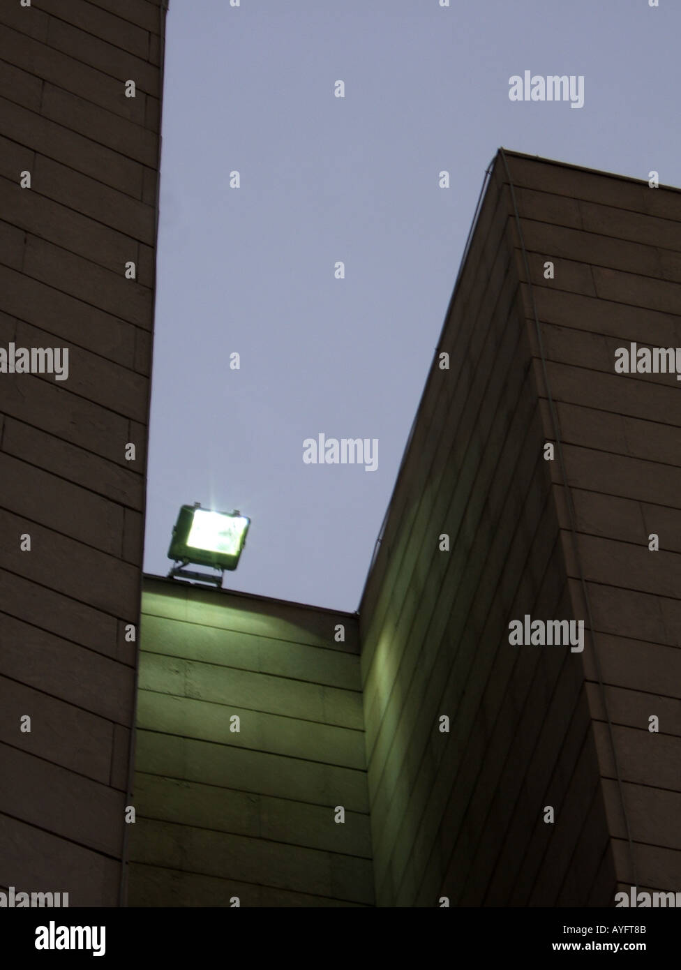 one security light on office block Stock Photo - Alamy