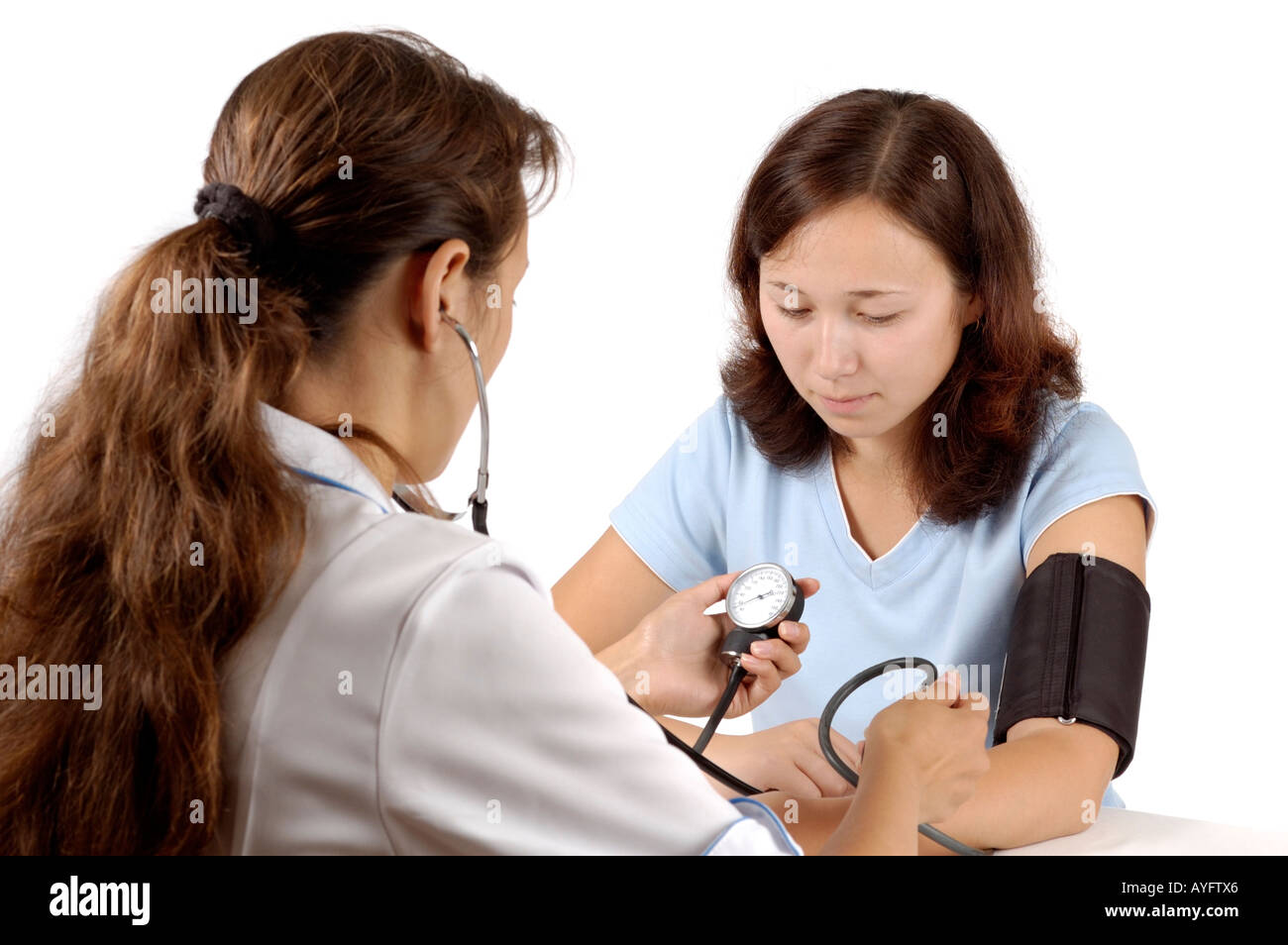 Young nurse measuring blood pressure Stock Photo - Alamy