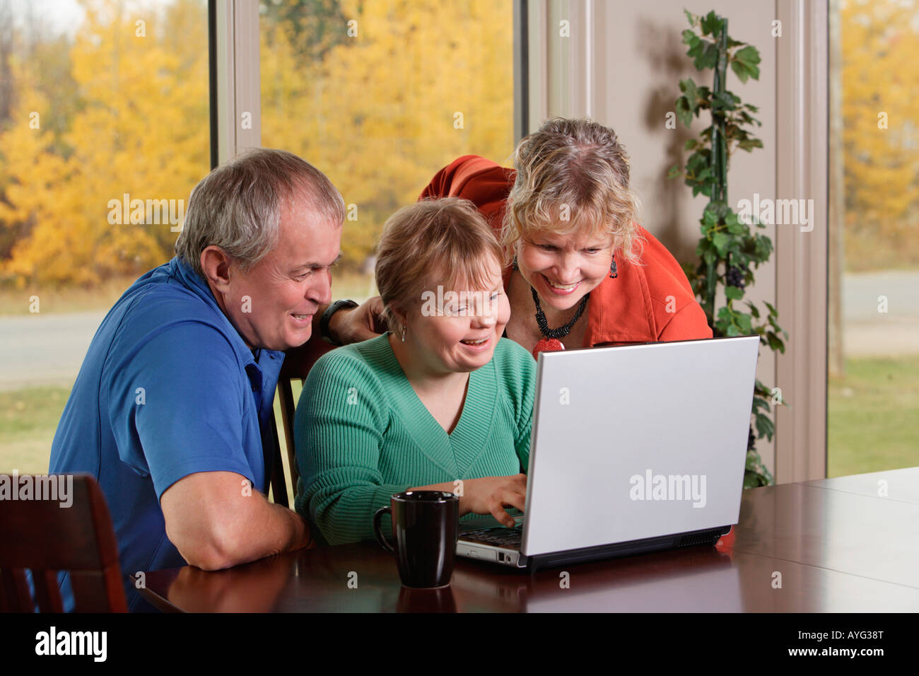 Family on laptop computer Stock Photo - Alamy