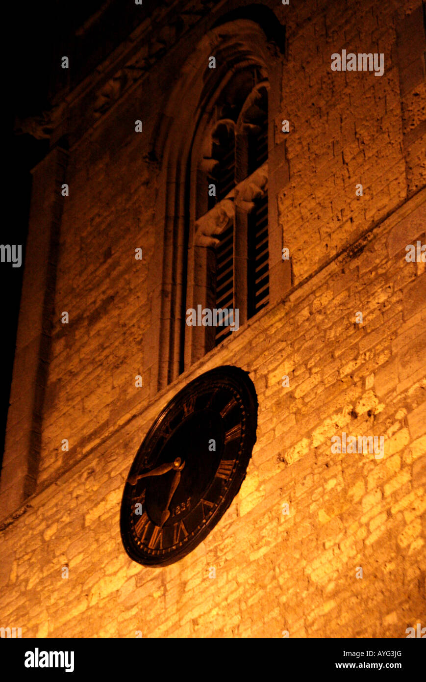 church clock by night Stock Photo - Alamy