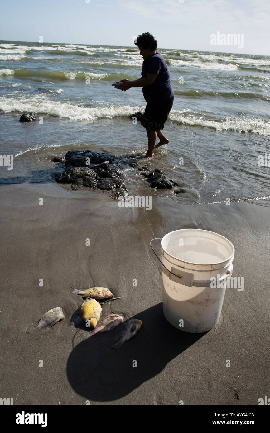 Woman catching fish from Lake Colcibolca Playa Santo Domingo Ometepe ...