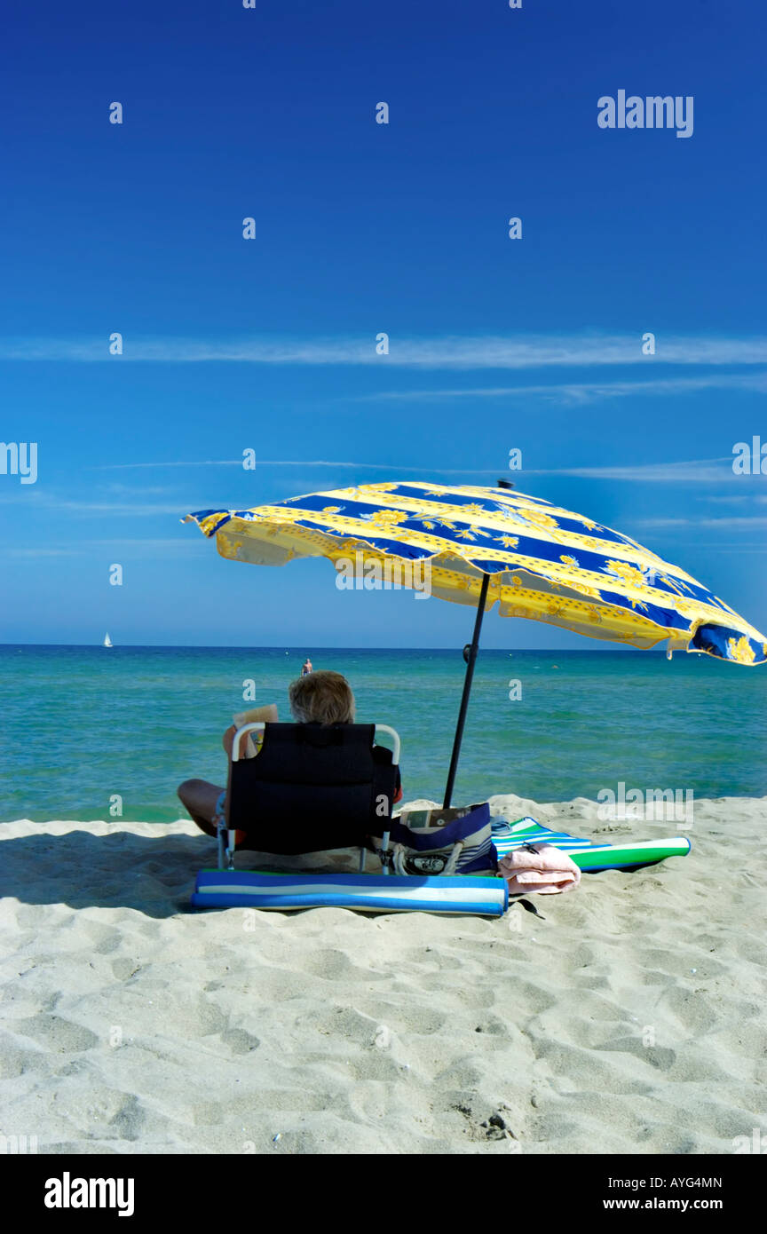 Perpignan, France, Beach Scene with Woman Relaxing in Shade Under ...
