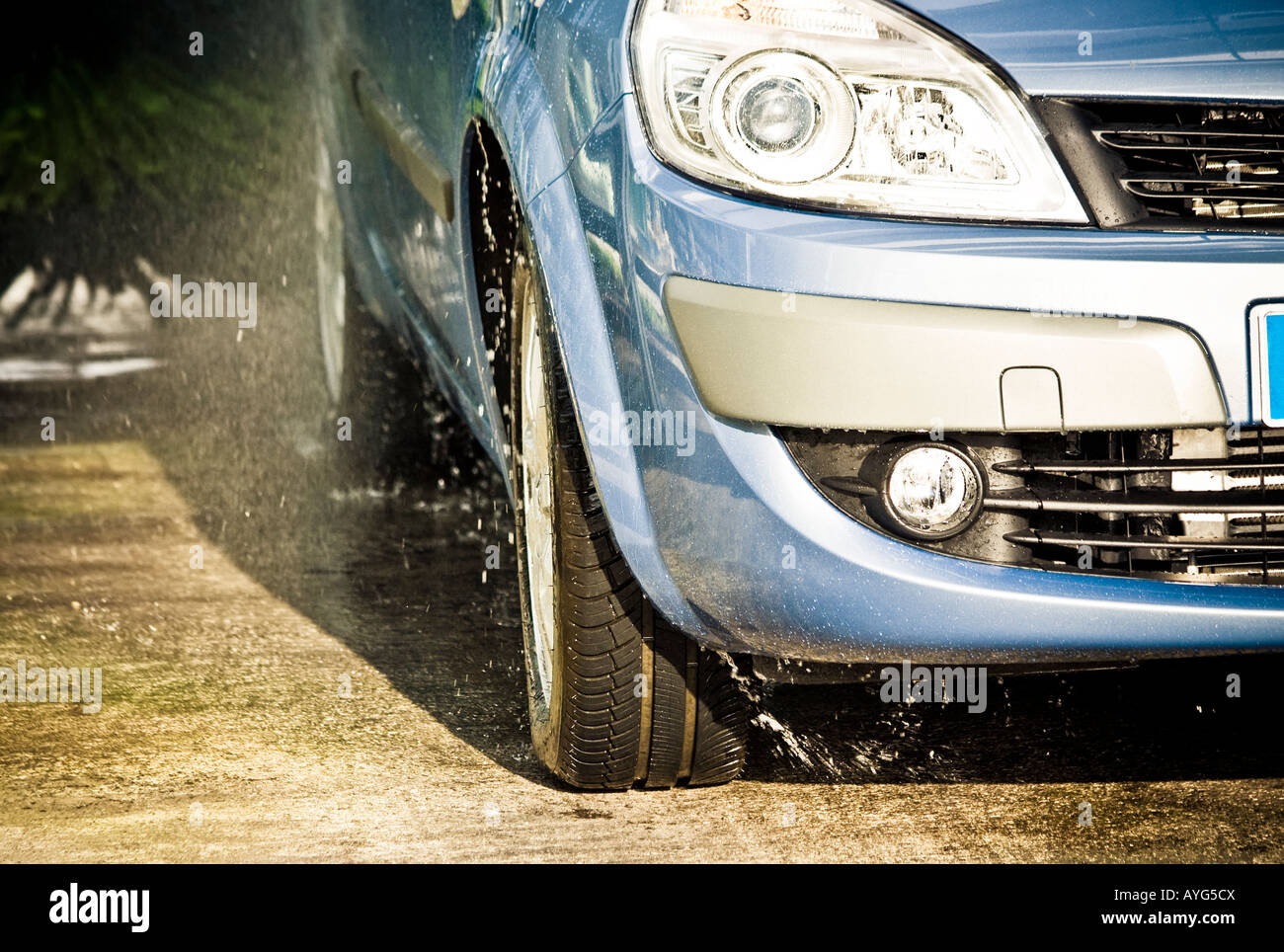 Blue car during washing process Stock Photo - Alamy