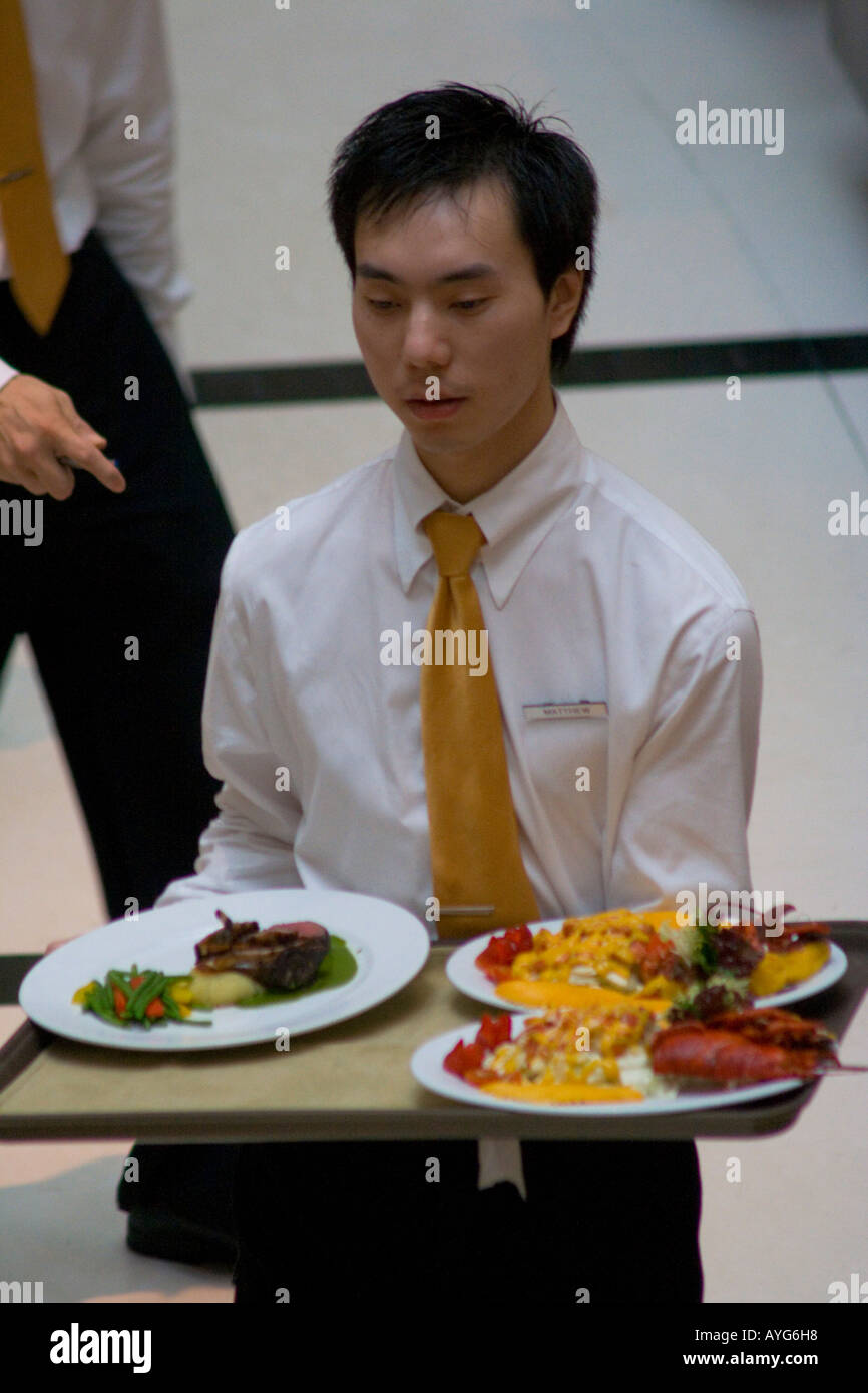 Wait Staff Delivering a Meal at an Upscale Restaurant Hong Kong China ...
