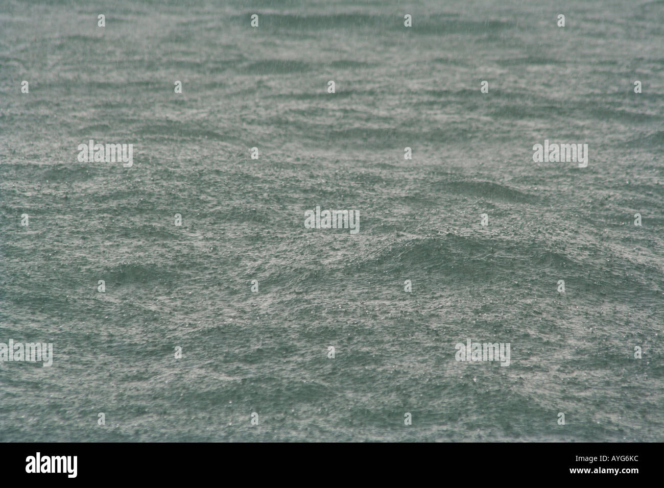 Rain drops fall on sea hi-res stock photography and images - Alamy