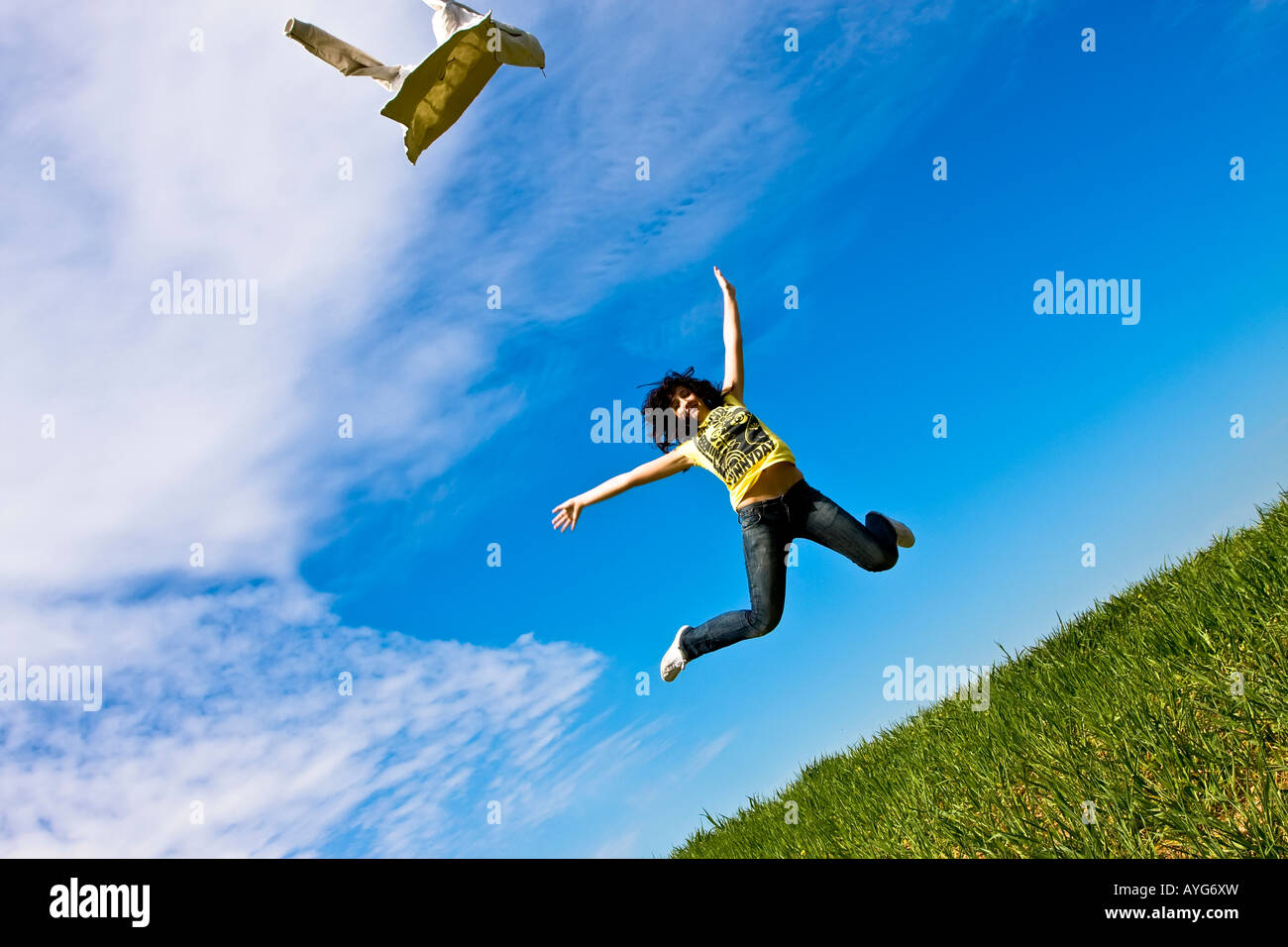 Happy woman throwing her jacket to the air Stock Photo - Alamy