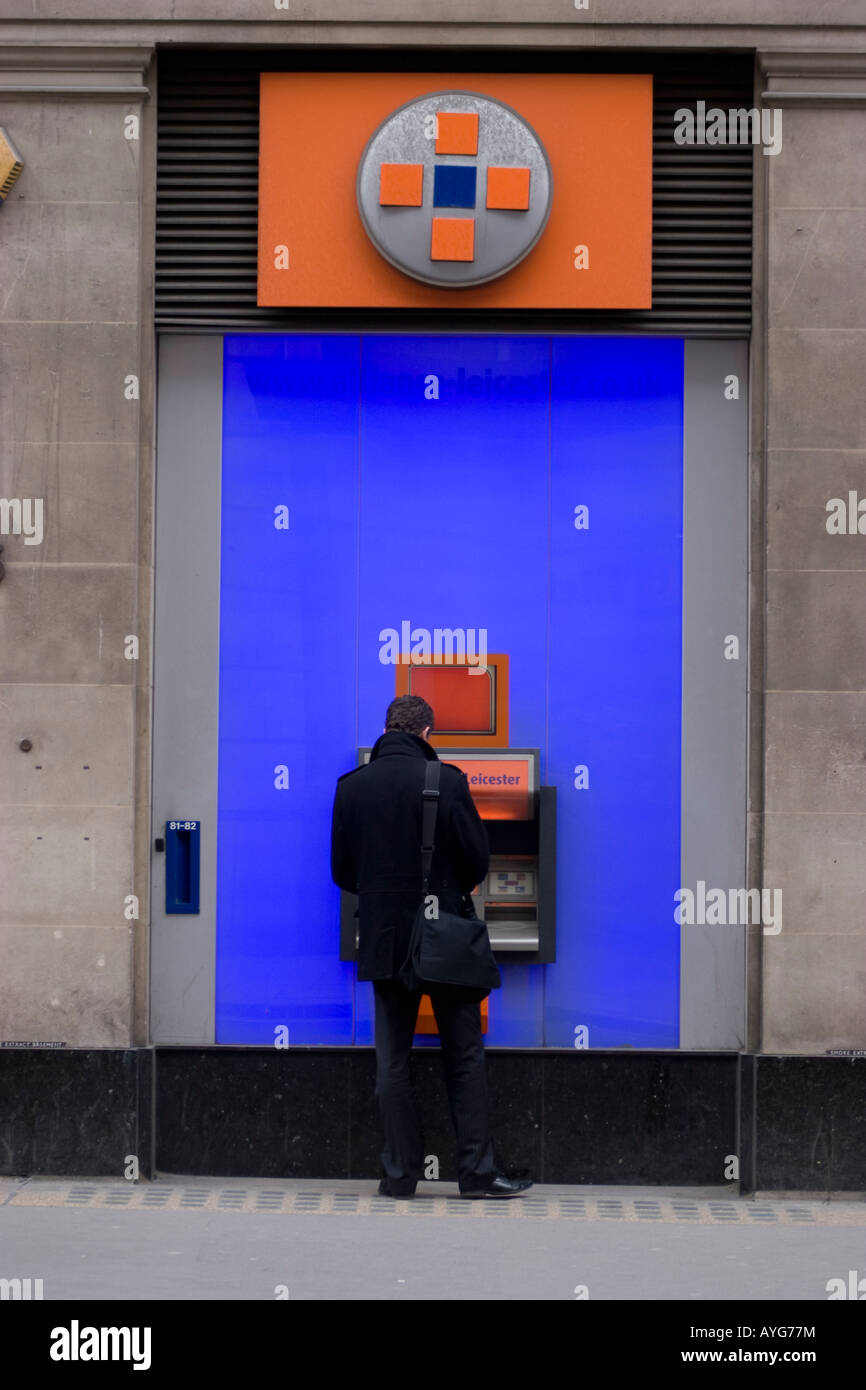 alliance and leicester bank atm cash till with customer drawing money ...