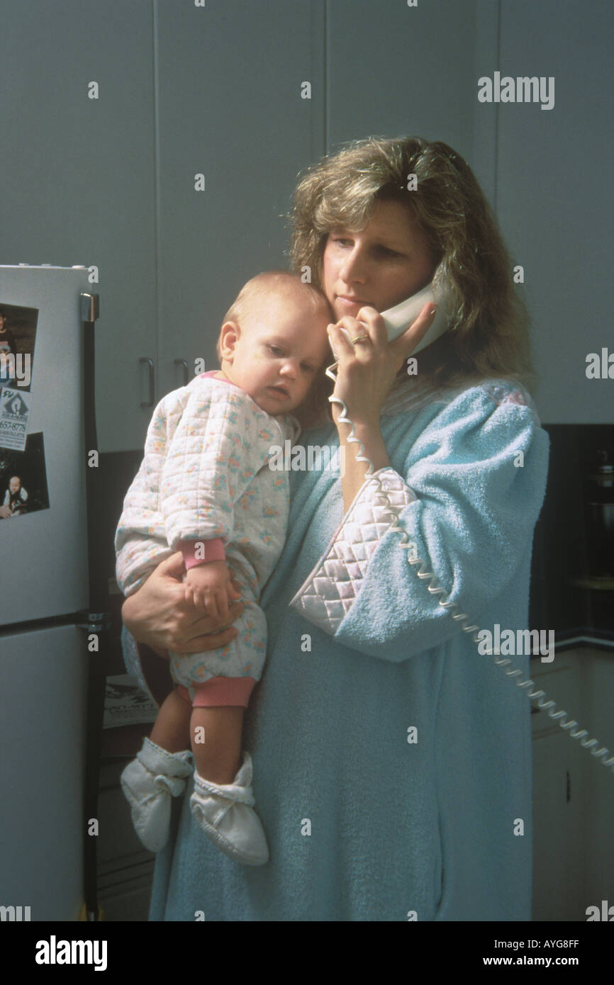 Concerned mother seeks medical advice hi-res stock photography and ...