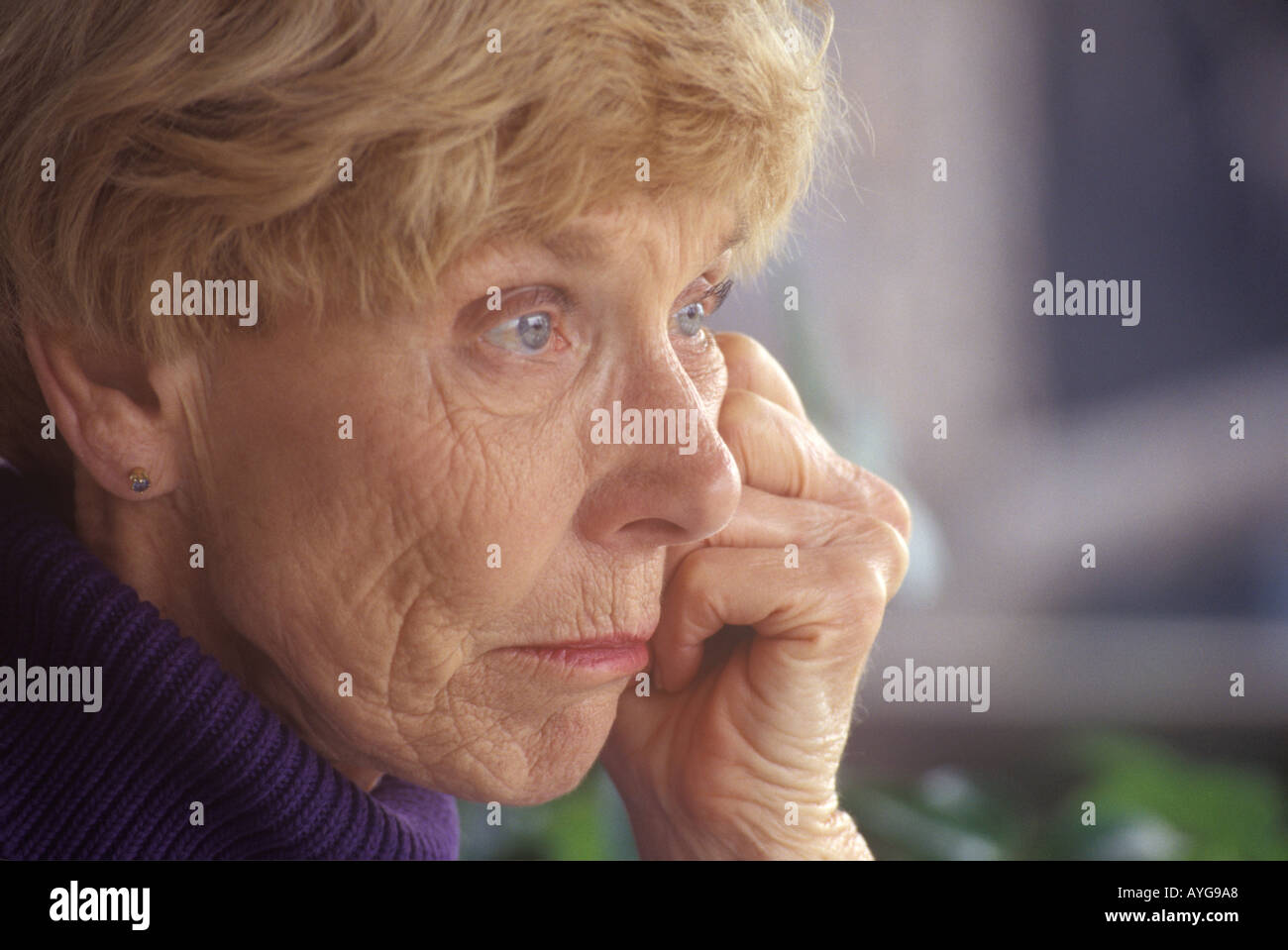 Worried senior woman Stock Photo - Alamy