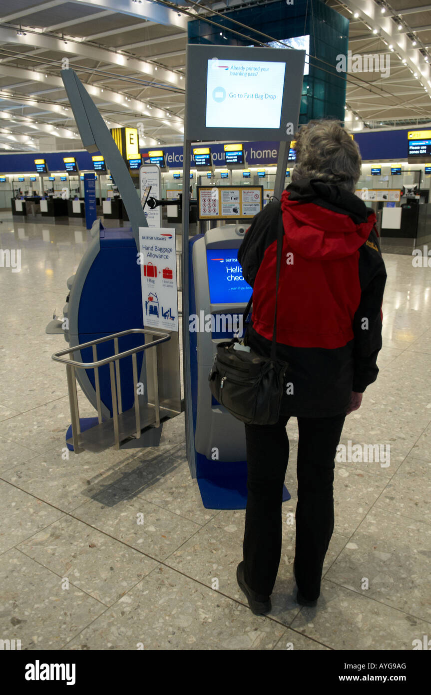 Heathrow Terminal 5 lady checking in using auto check in - LADY IN RED ...