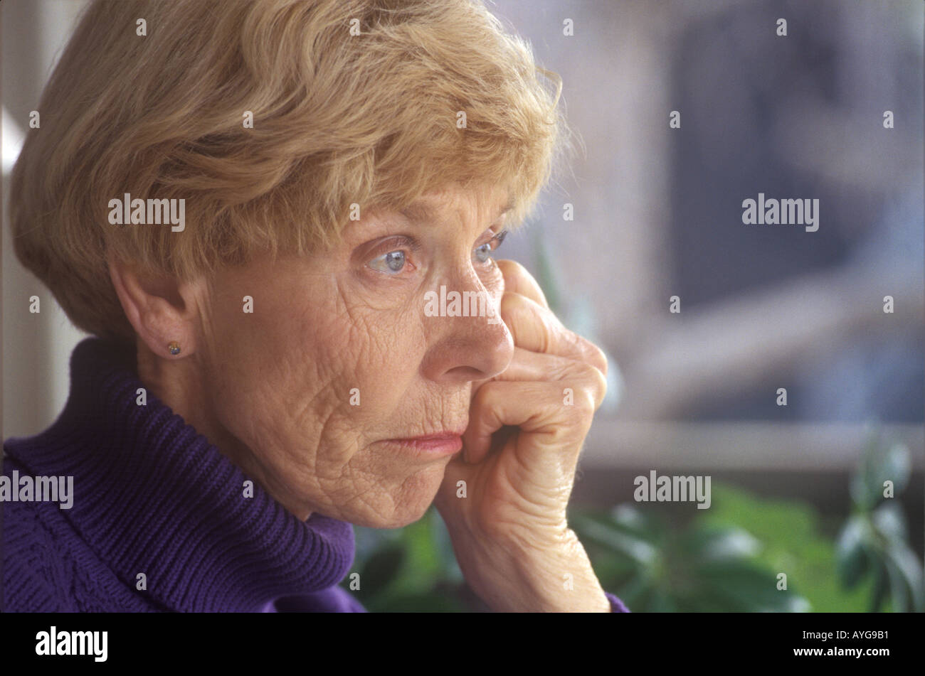 Worried senior woman Stock Photo - Alamy